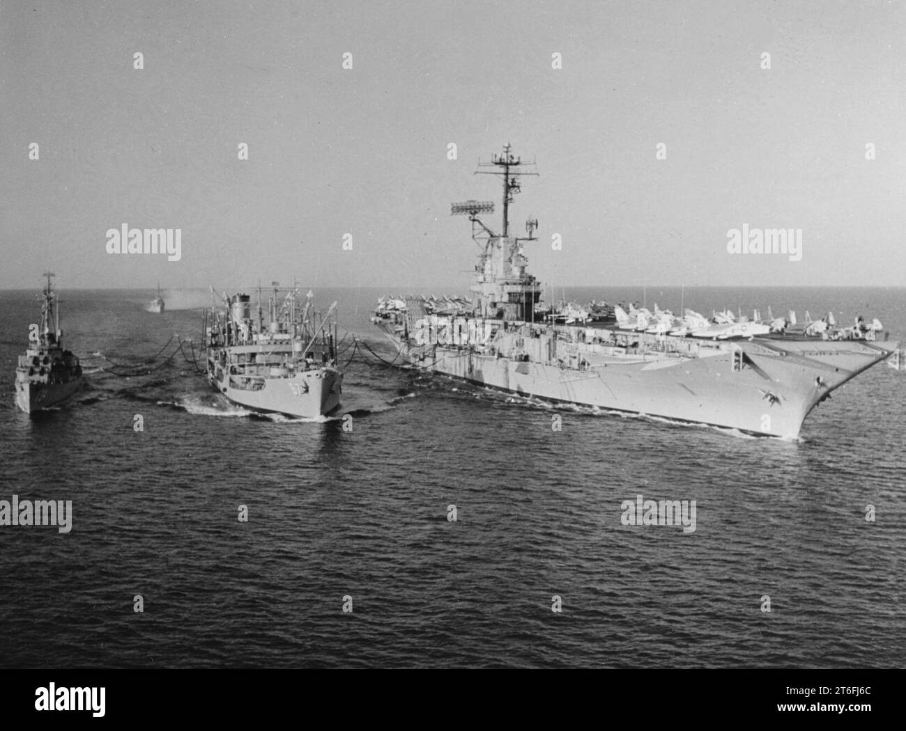 USS Shangri-La (CVA-38) and USS Purdy (DD-734) refueling from USS ...