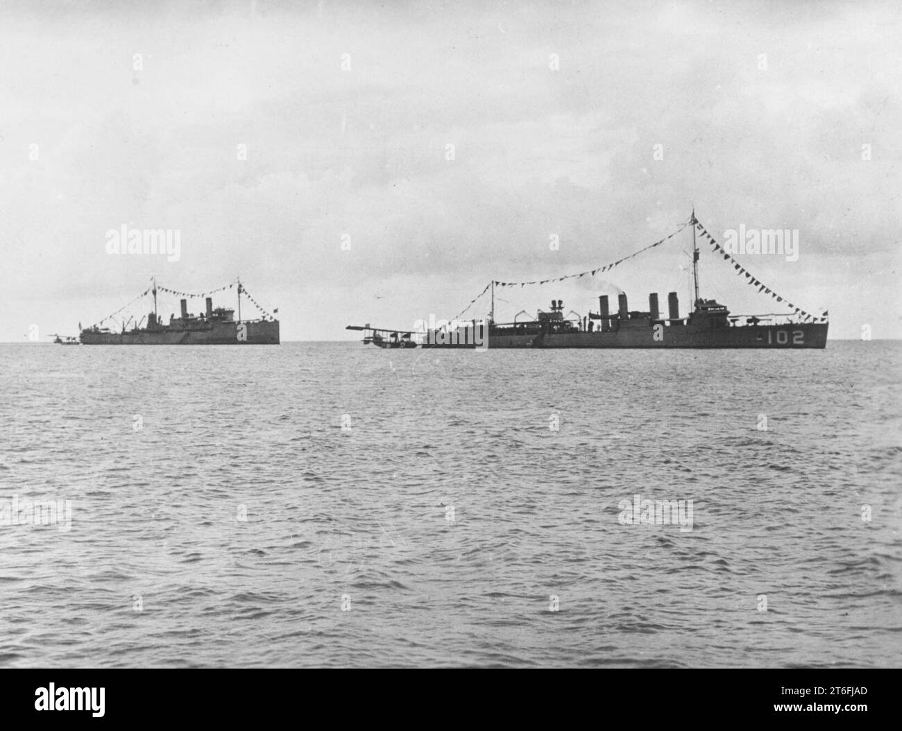 USS Shawmut (CM-4) and USS Mahan (DM-7) tending seaplanes, circa 1920 ...
