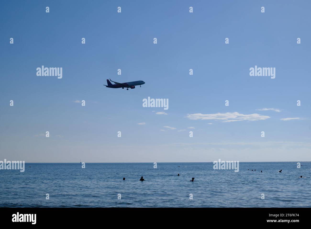 Holiday flight coming in to land at Larnaca airport over the heads of ...