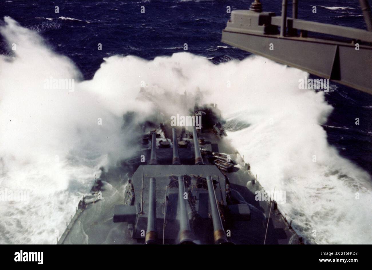 USS South Dakota (BB-57) steams into heavy seas on 24 February 1945 ...
