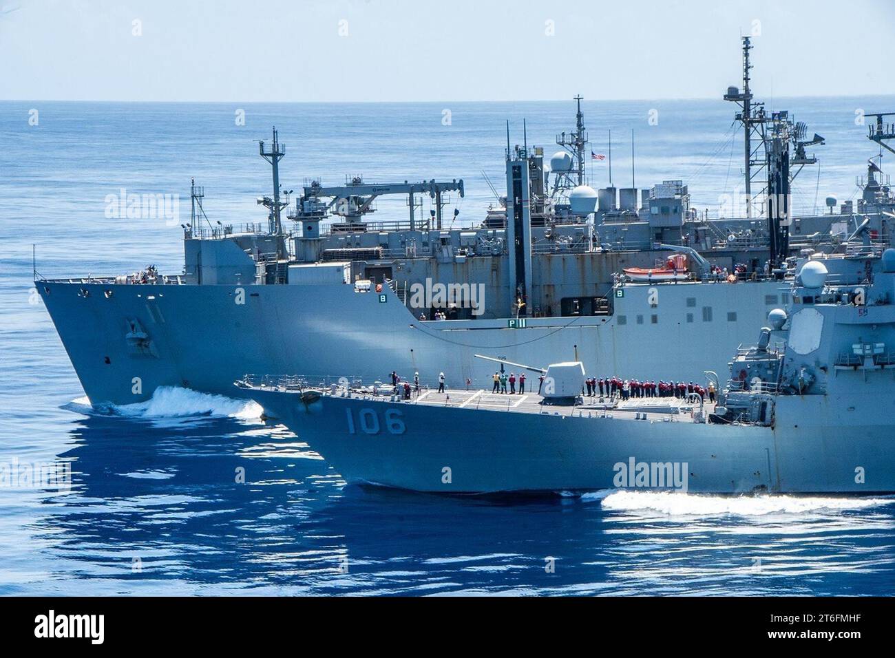 USS Stockdale (DDG 106), front, and USS Shiloh (CG 67) conduct a replenishment-at-sea with USNS ...