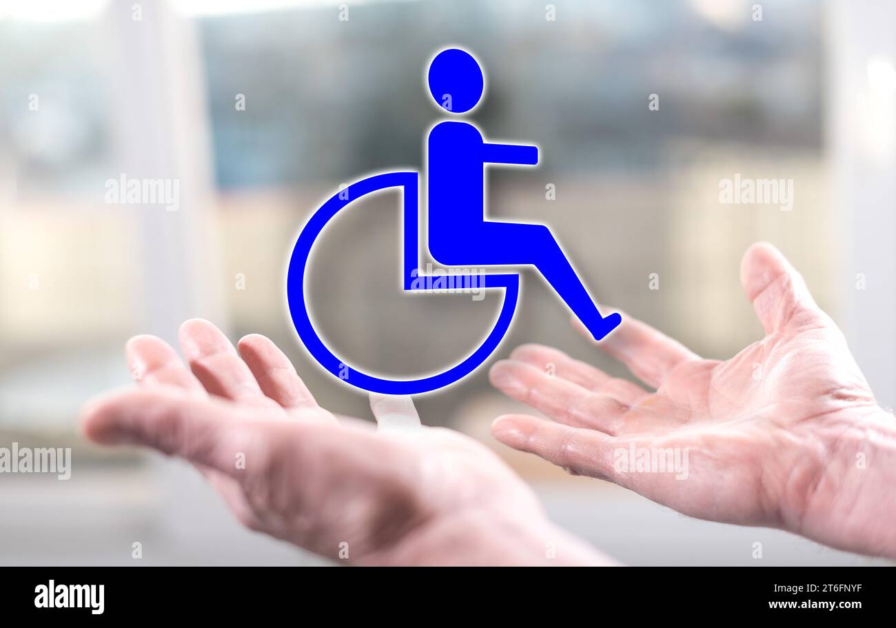 Disability insurance concept above the hands of a man Stock Photo - Alamy