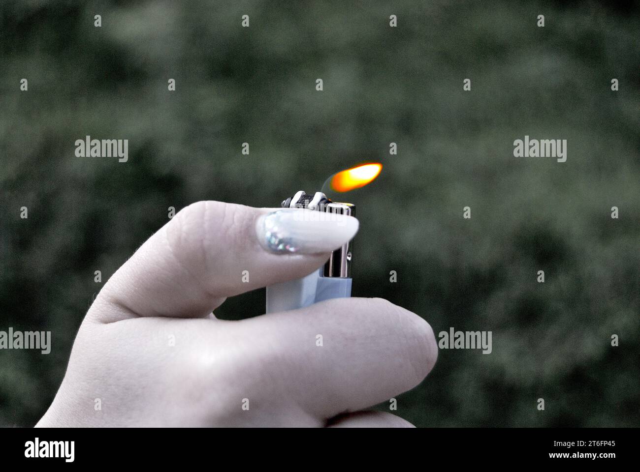 Small flame from a lighter Stock Photo - Alamy