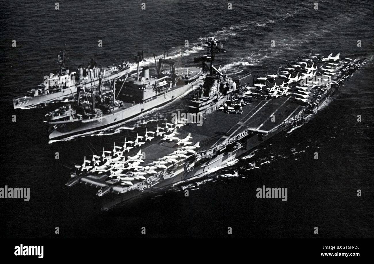 USS Suribachi (AE-21) replenishing USS Shangri-La (CVA-38) and USS ...