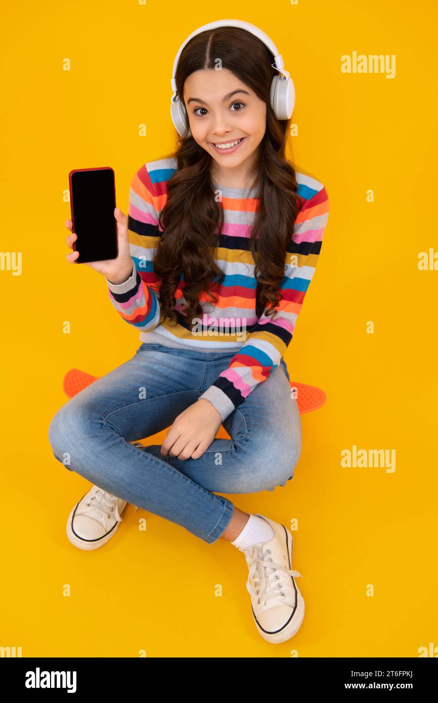 Teenage girl with smart phone. Portrait of teen child using mobile ...