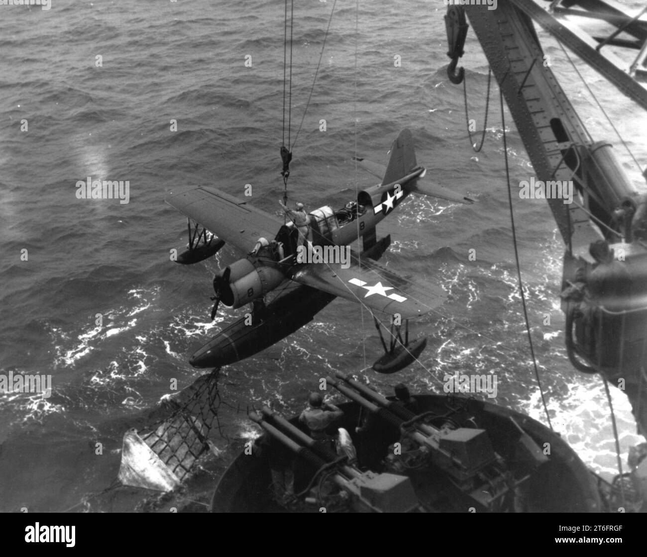 USS Texas (BB-35) recovers a Vought OS2U Kingfisher off Iwo Jima 1945 ...