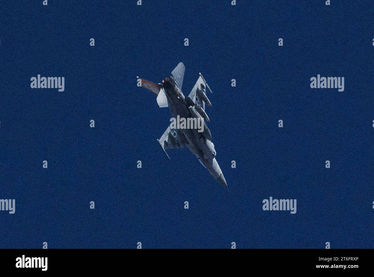 An Israeli jet fighter flies near the Gaza Strip, as seen from southern ...