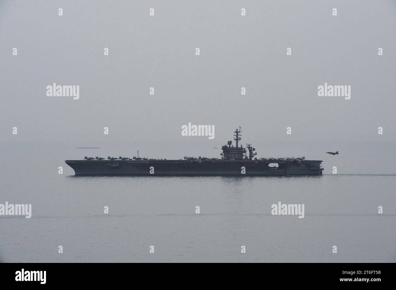 USS Theodore Roosevelt (CVN 71) sails in the U.S. 5th Fleet area of ...