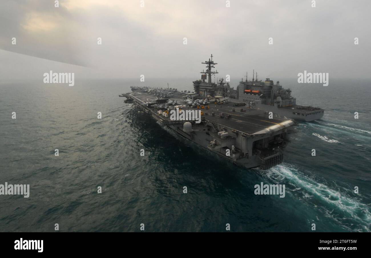 USS Theodore Roosevelt (CVN-71) alongside USNS Alan Shepard (T-AKE-3) during underway ...