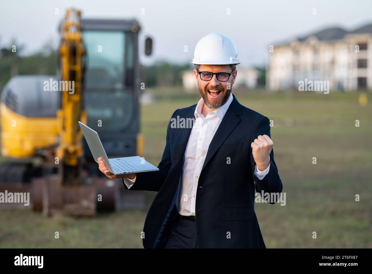 Civil engineer worker at a construction site. Engineer man in front of ...