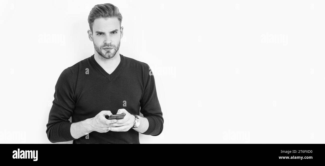 Handsome man in casual style text message on mobile phone isolated on ...