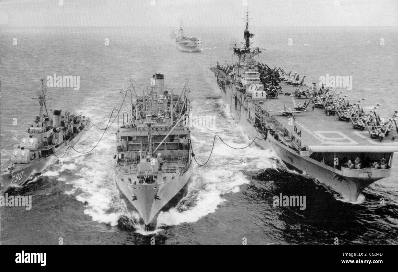 USS Tolovana (AO-64) refueling USS Antietam (CV-36) and USS Shelton (DD ...