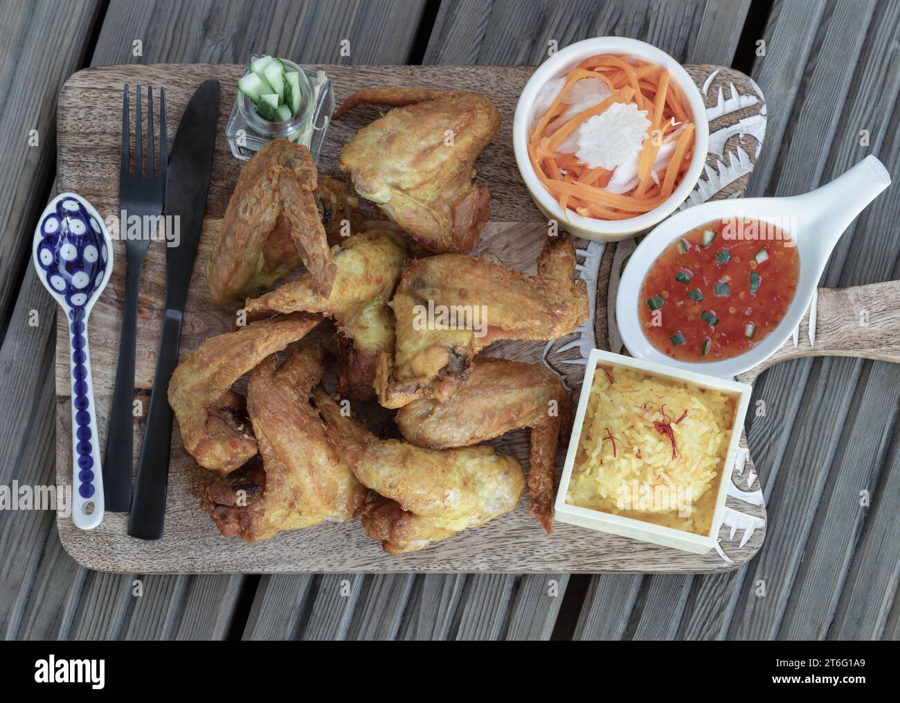 Delicious Fried chicken wings served with Homemade yellow jasmine rice ...