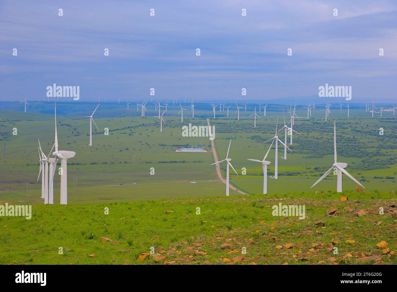 Windmills aerial view. Renewable energy. Large wind turbines with ...