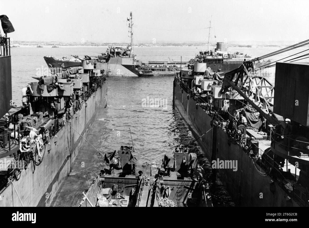 USS Wabash (AOG-4) crosses astern of USS Oak Hill (LSD-7) on 18 May ...