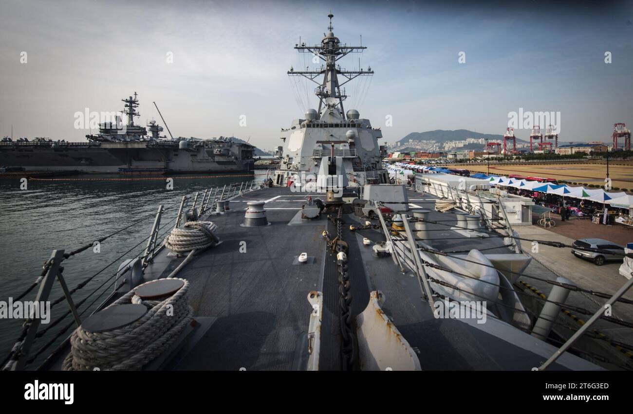 USS Wayne E. Meyer (DDG 108) is moored near USS Carl Vinson in Busan ...
