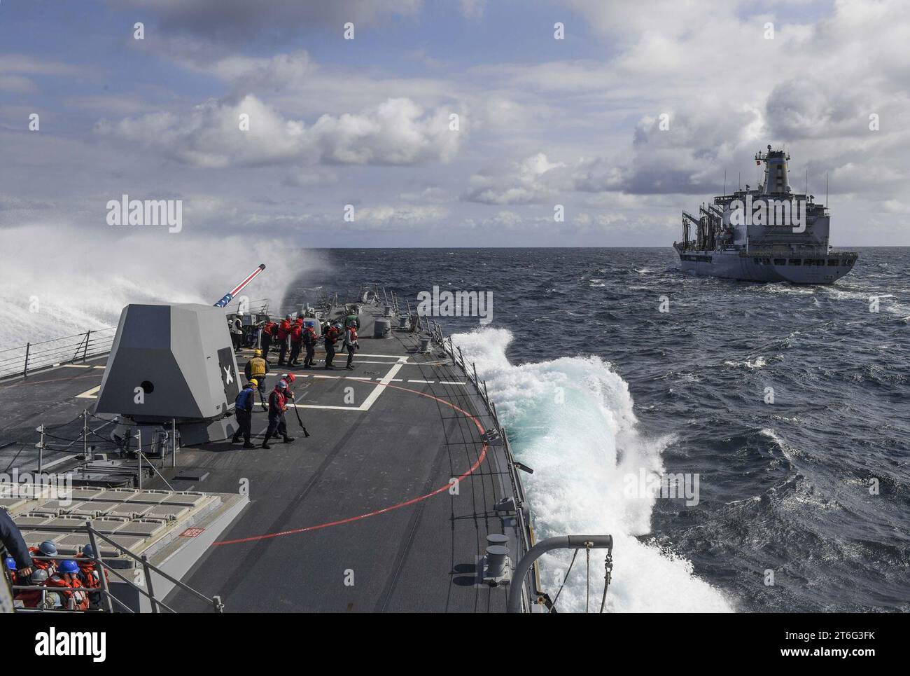 USS Wayne E. Meyer approaches the fleet replenishment oiler USNS ...