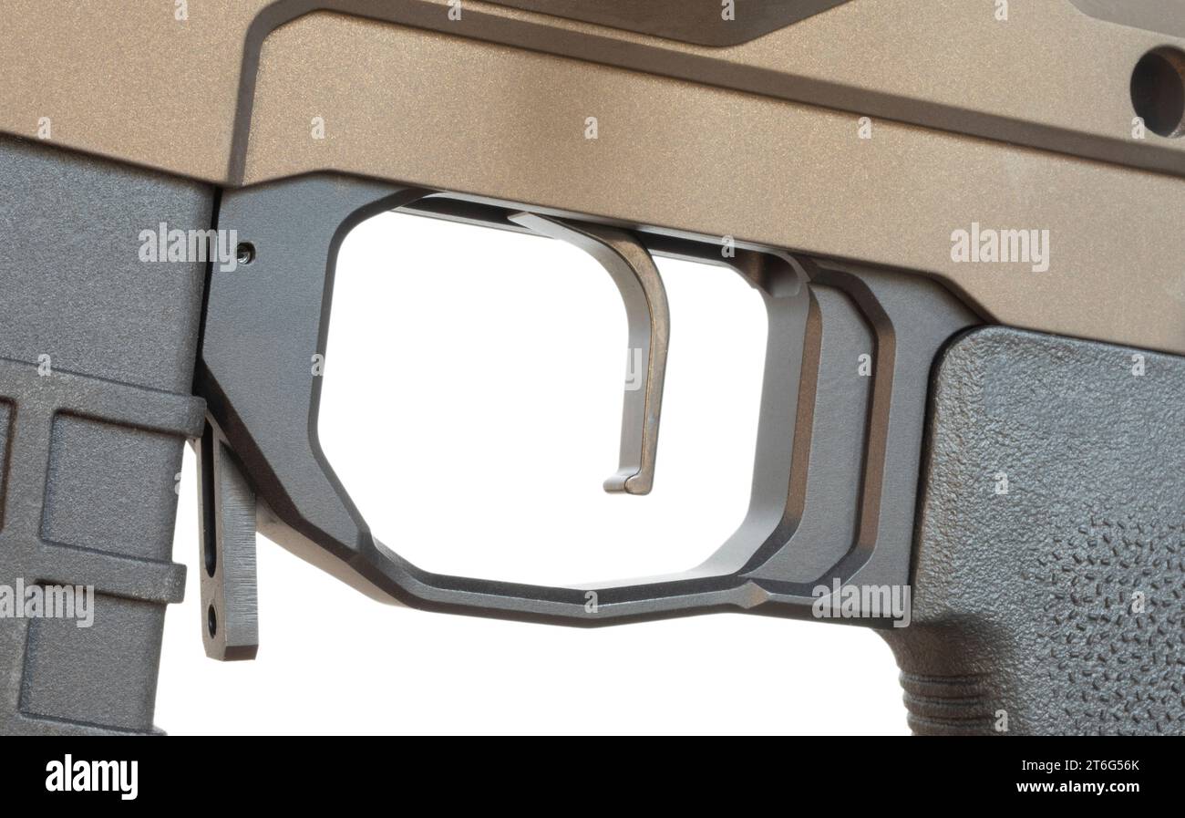 Copper colored high powered rifle trigger seen from slightly in front ...