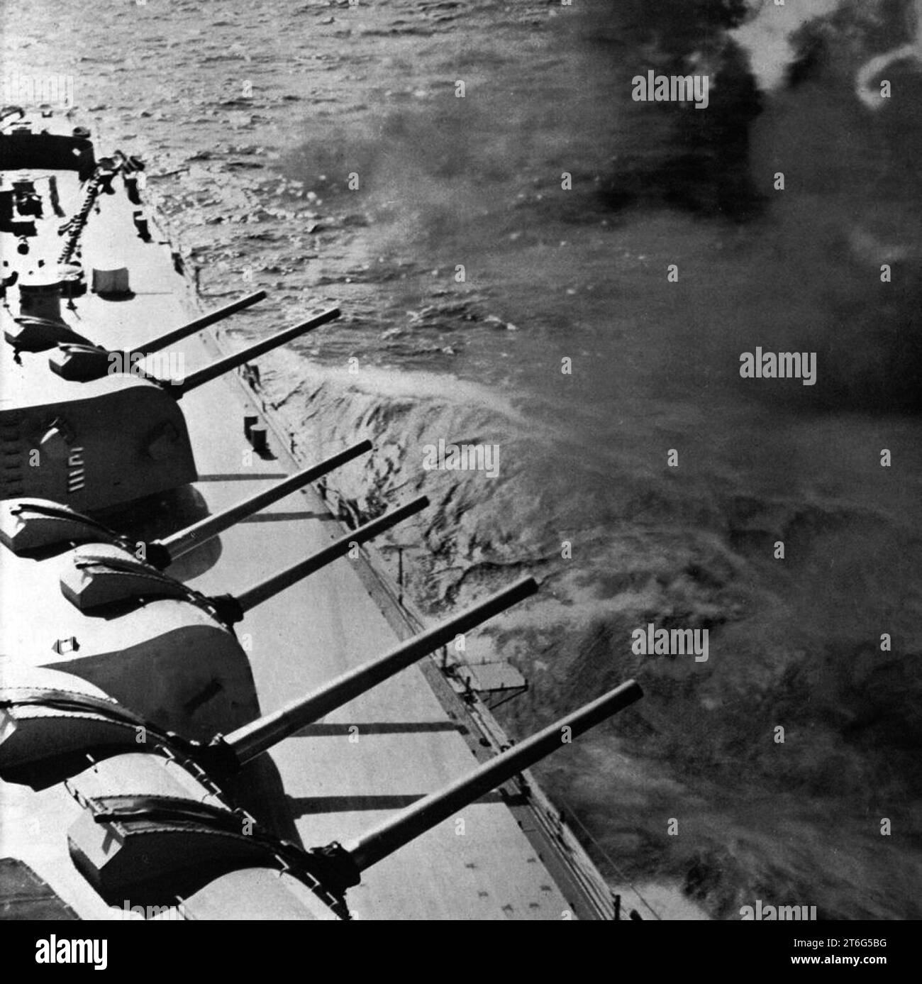 USS Worcester (CL-144) fires its forward 155mm guns, circa in 1957 ...