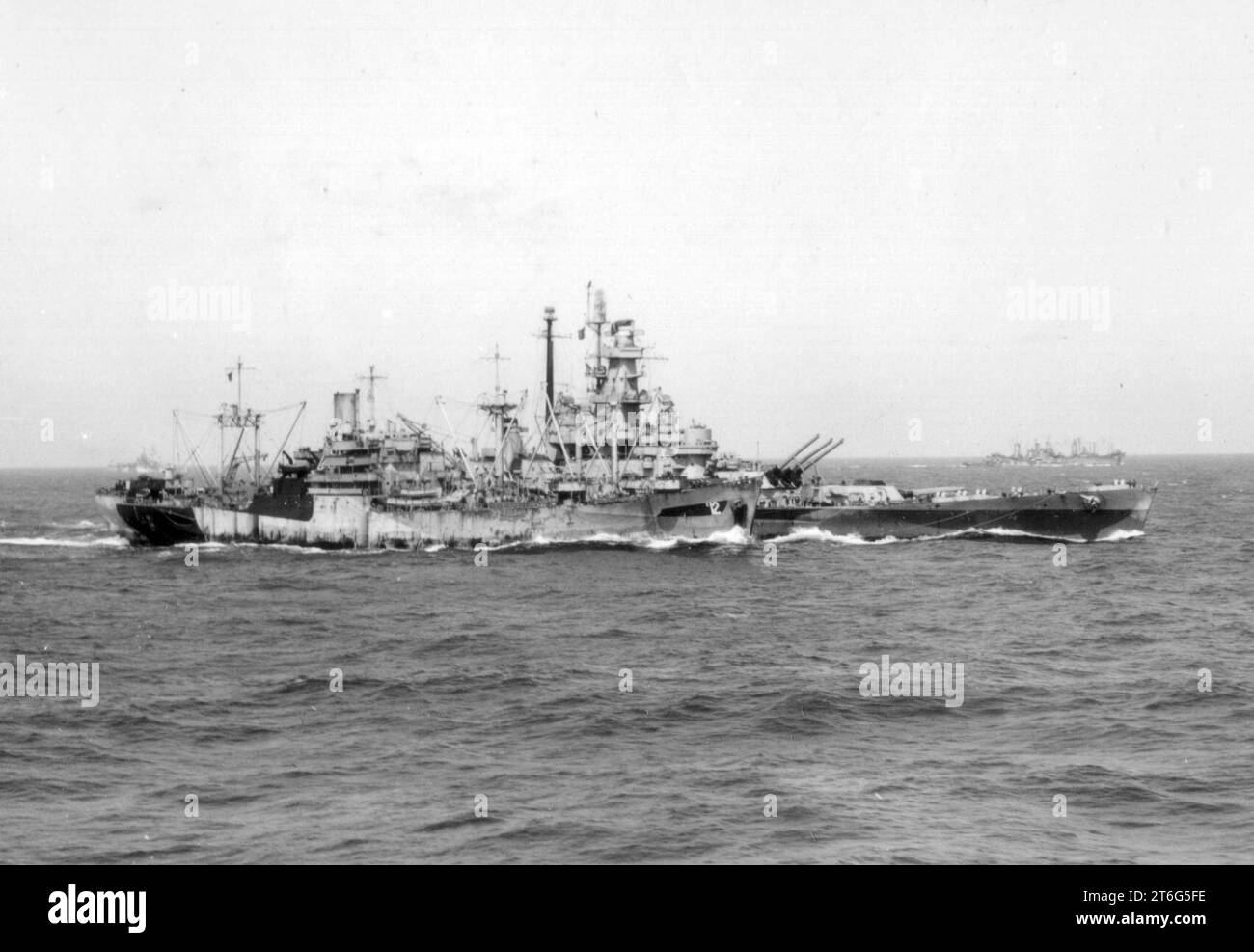 USS Wrangell (AE-12) replenishing USS Massachusetts (BB-59) in 1945 ...