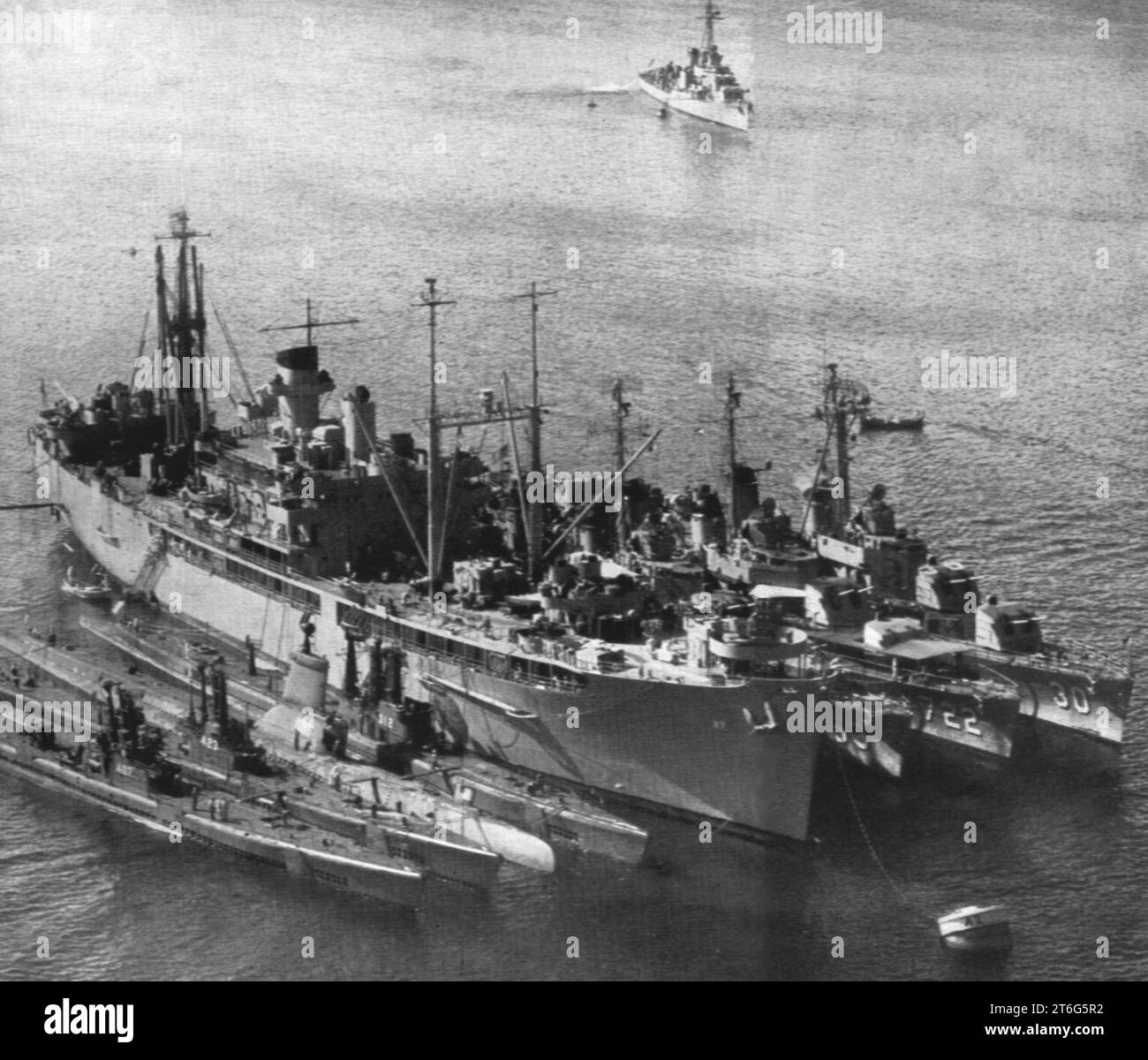 USS Yellowstone (AD-27) at Augusta Bay with submarines and destroyers ...