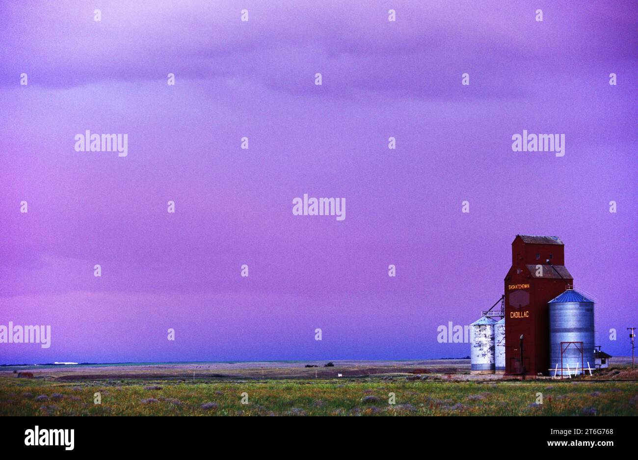 A red grain elevator with a pink sky in the Canadian prairies Stock ...