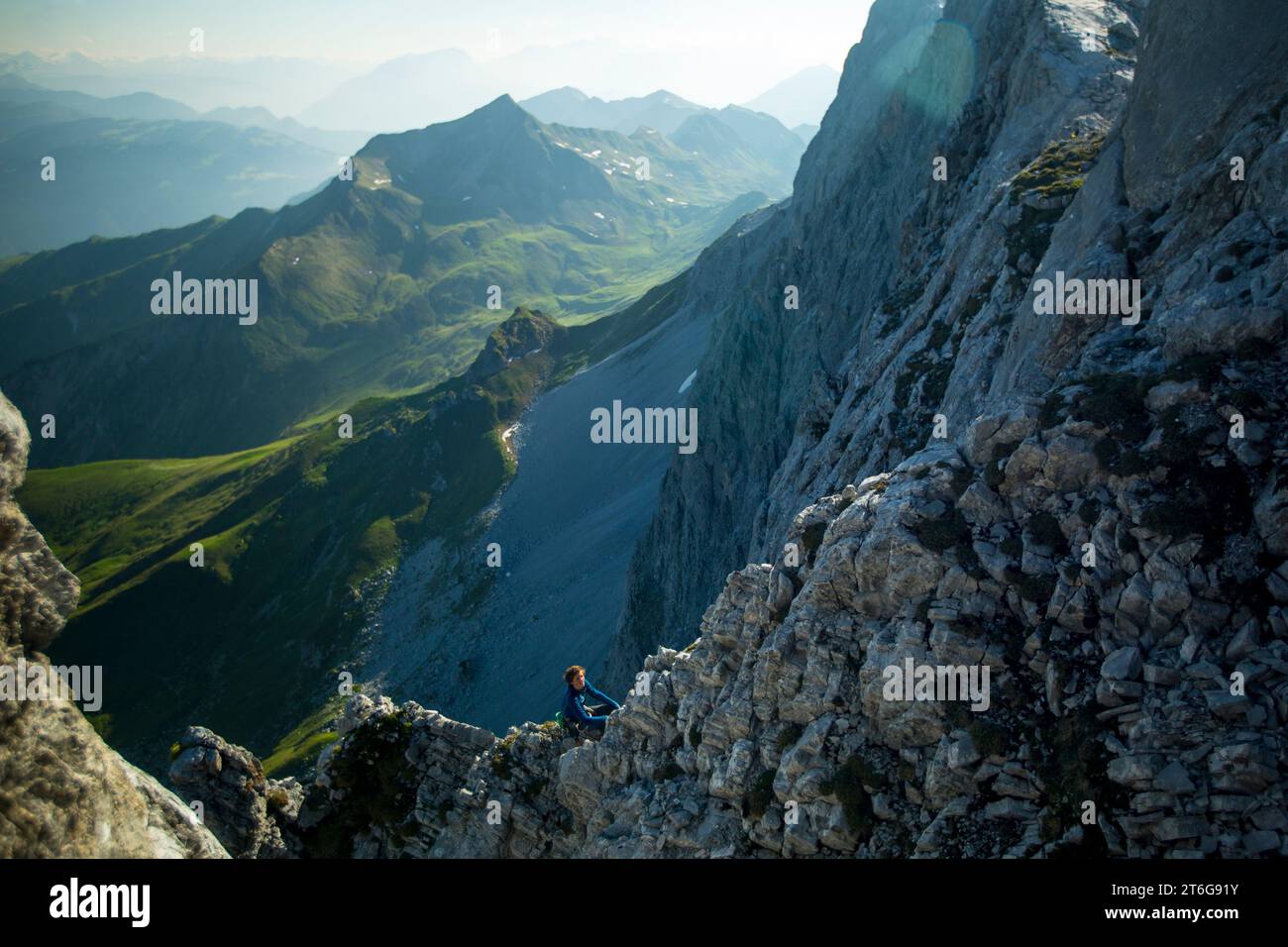 A climber heads up a ridge traverse Stock Photo - Alamy