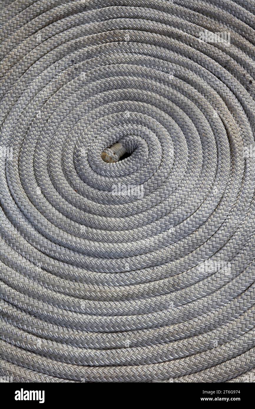 A neatly coiled line on deck of sailing yacht Stock Photo - Alamy