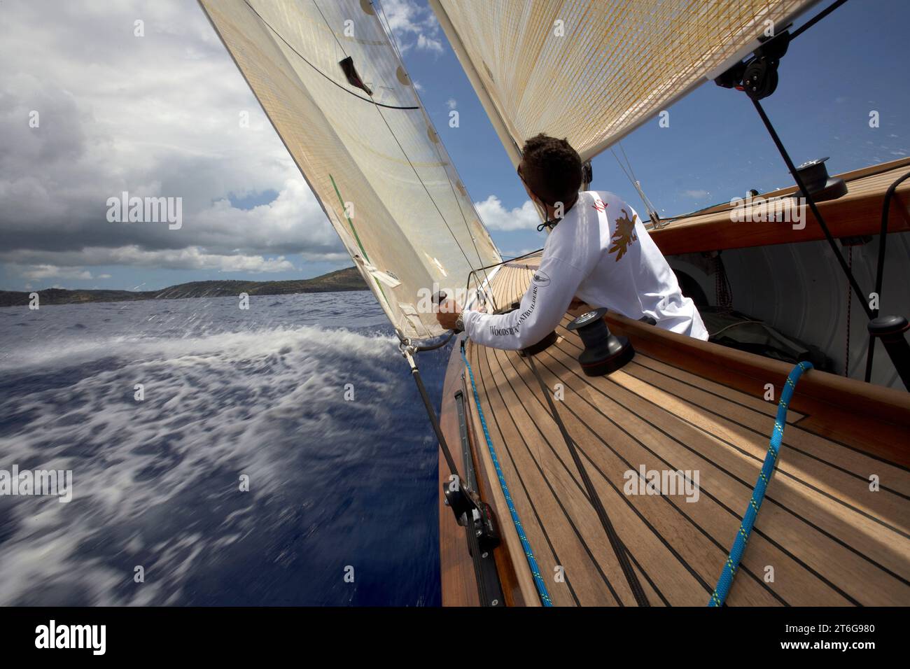 Crew trims the jib with precision on a sailing yacht Stock Photo - Alamy