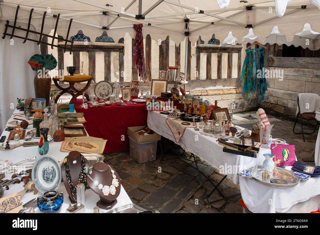 Flea Market stalls, Brocante, inside a marquee in front of Eglise ...