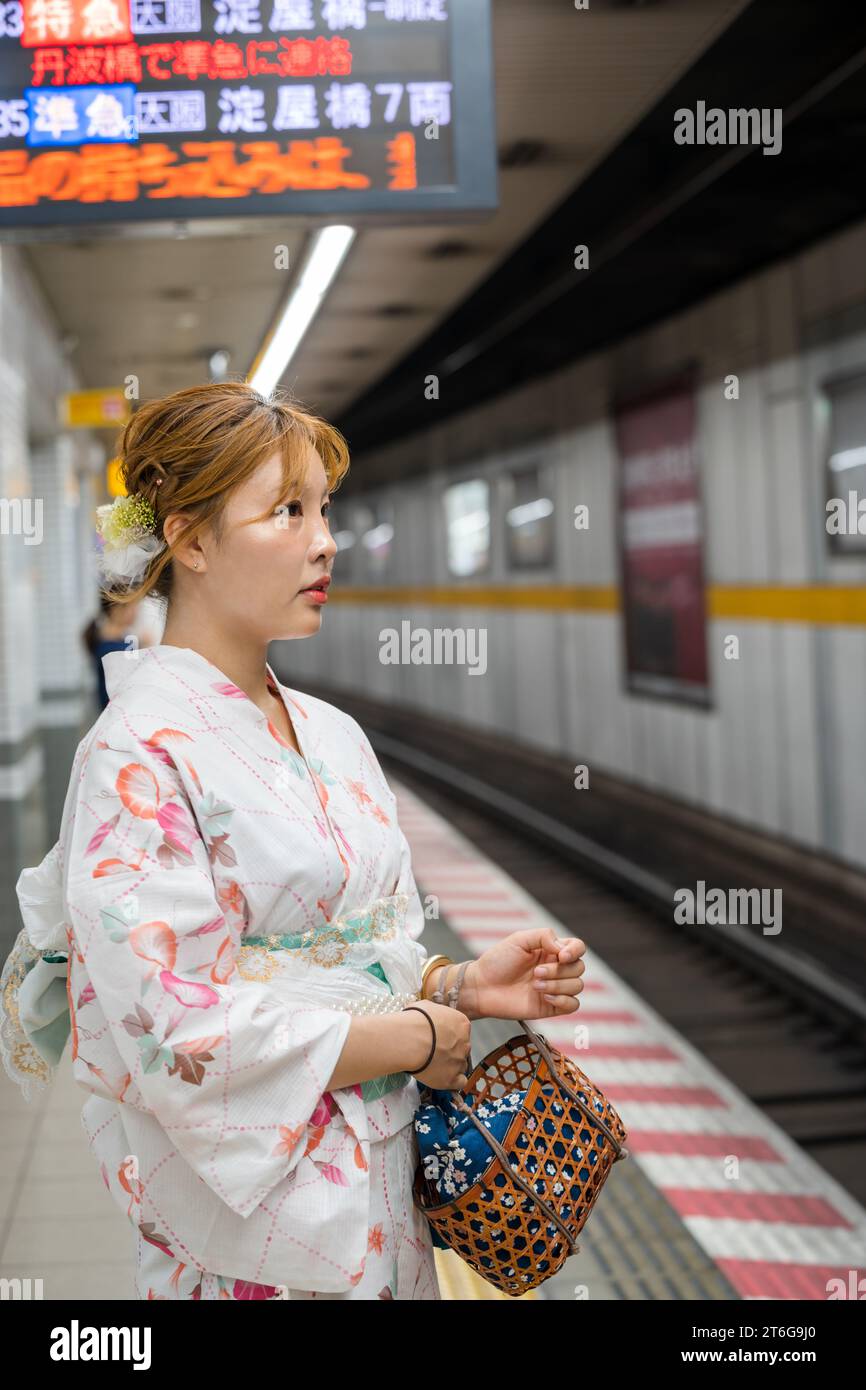 Portrait of a young woman wearing Japanese yukata summer kimono ...