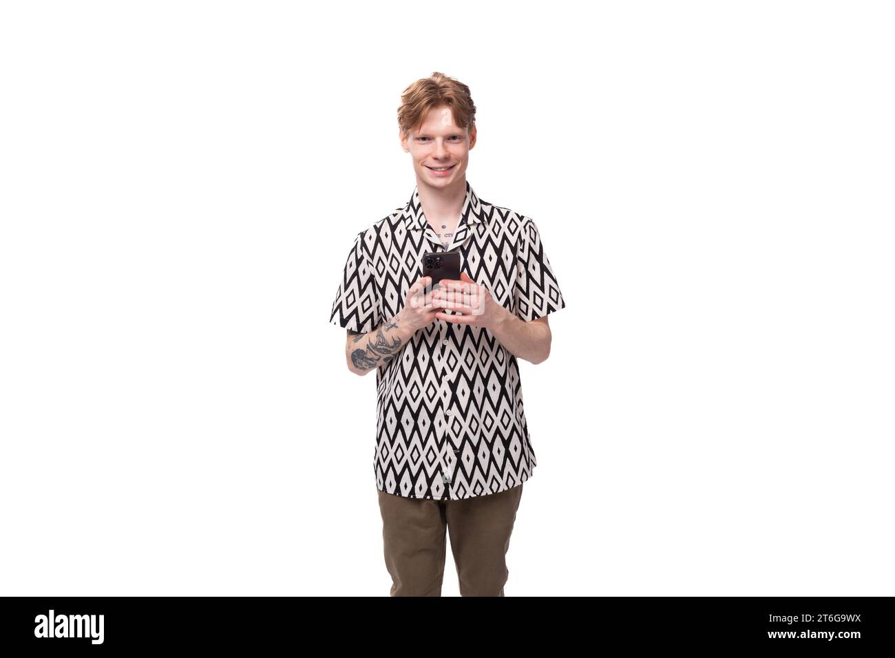 portrait of a slender young man with golden copper hair and a tattoo on ...