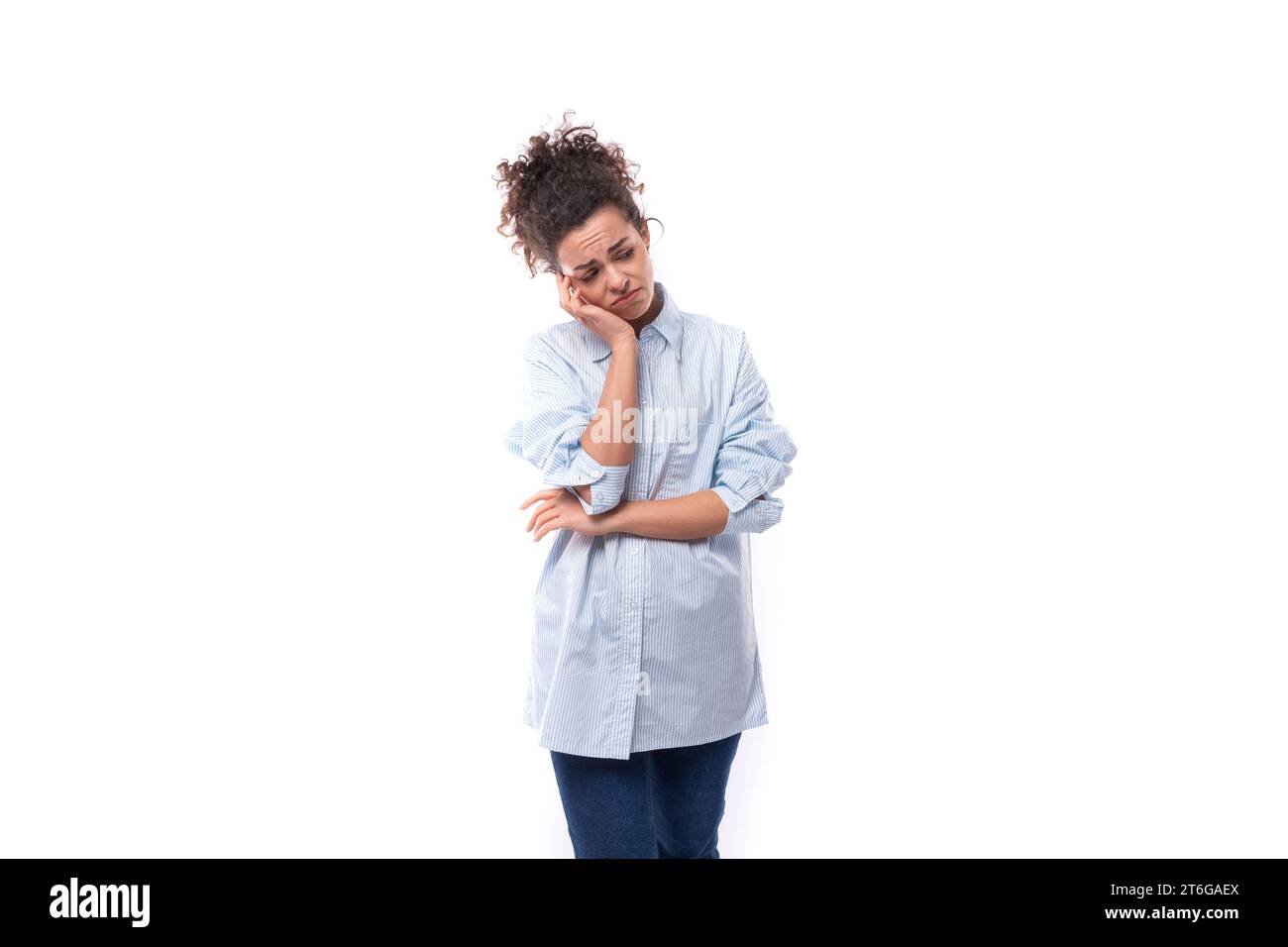young sad fashionista caucasian woman with curly black hair gathered in ...