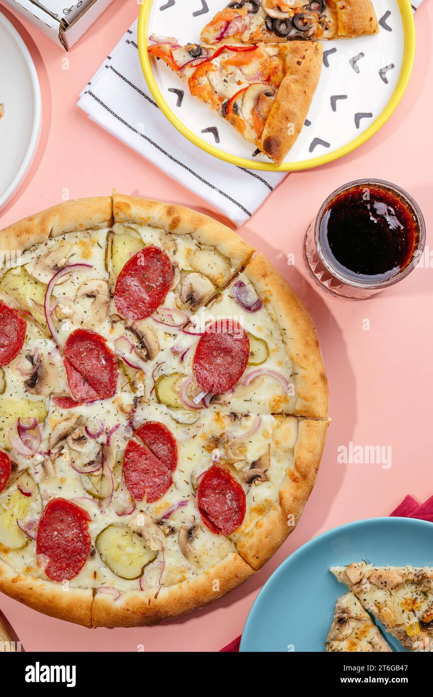 italian traditional pizza on a colored background Stock Photo - Alamy