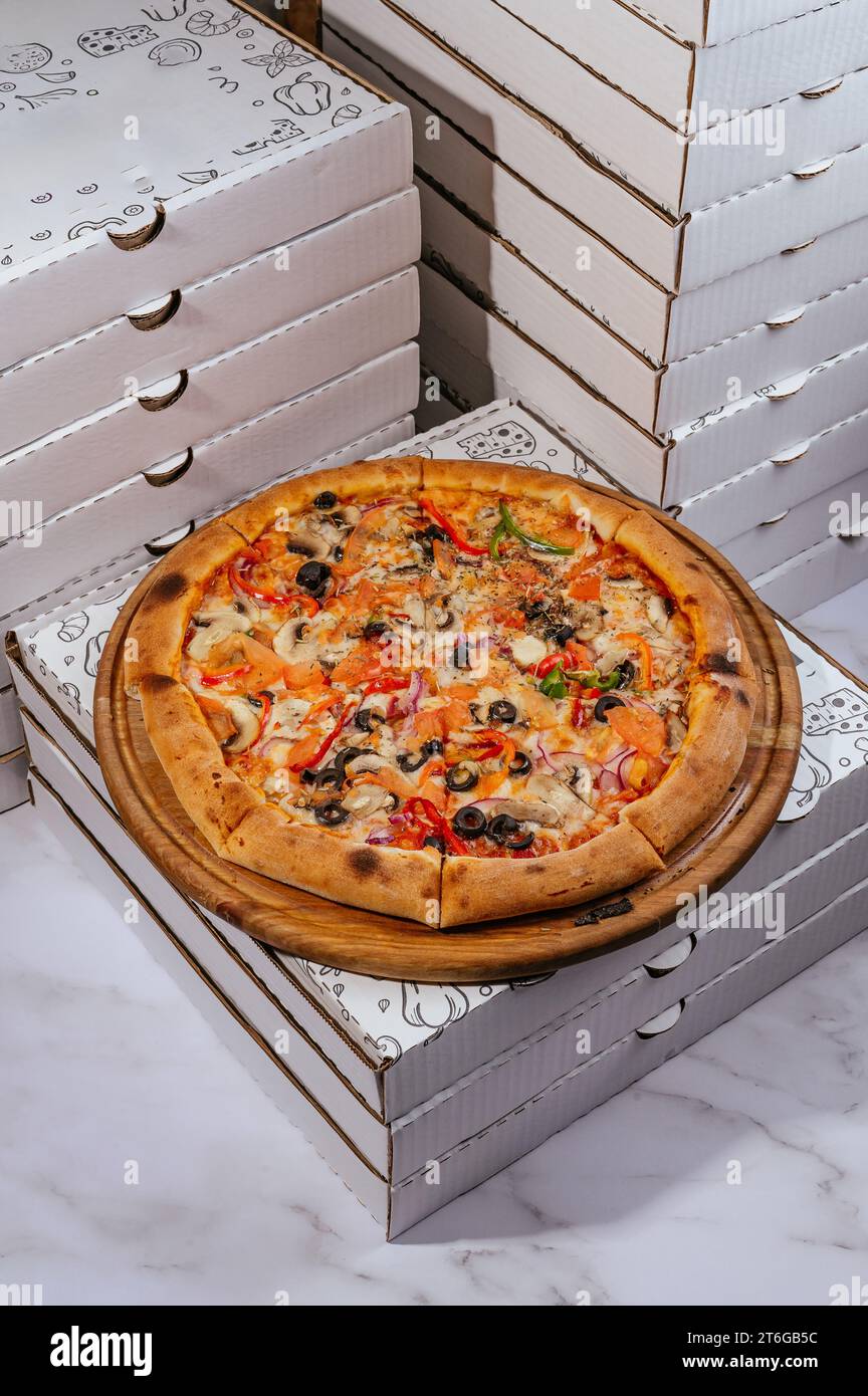 Italian traditional pizza on the background of boxes with you Stock ...