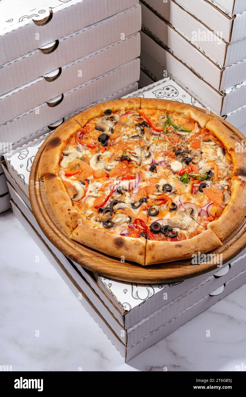 Italian traditional pizza on the background of boxes with you Stock ...