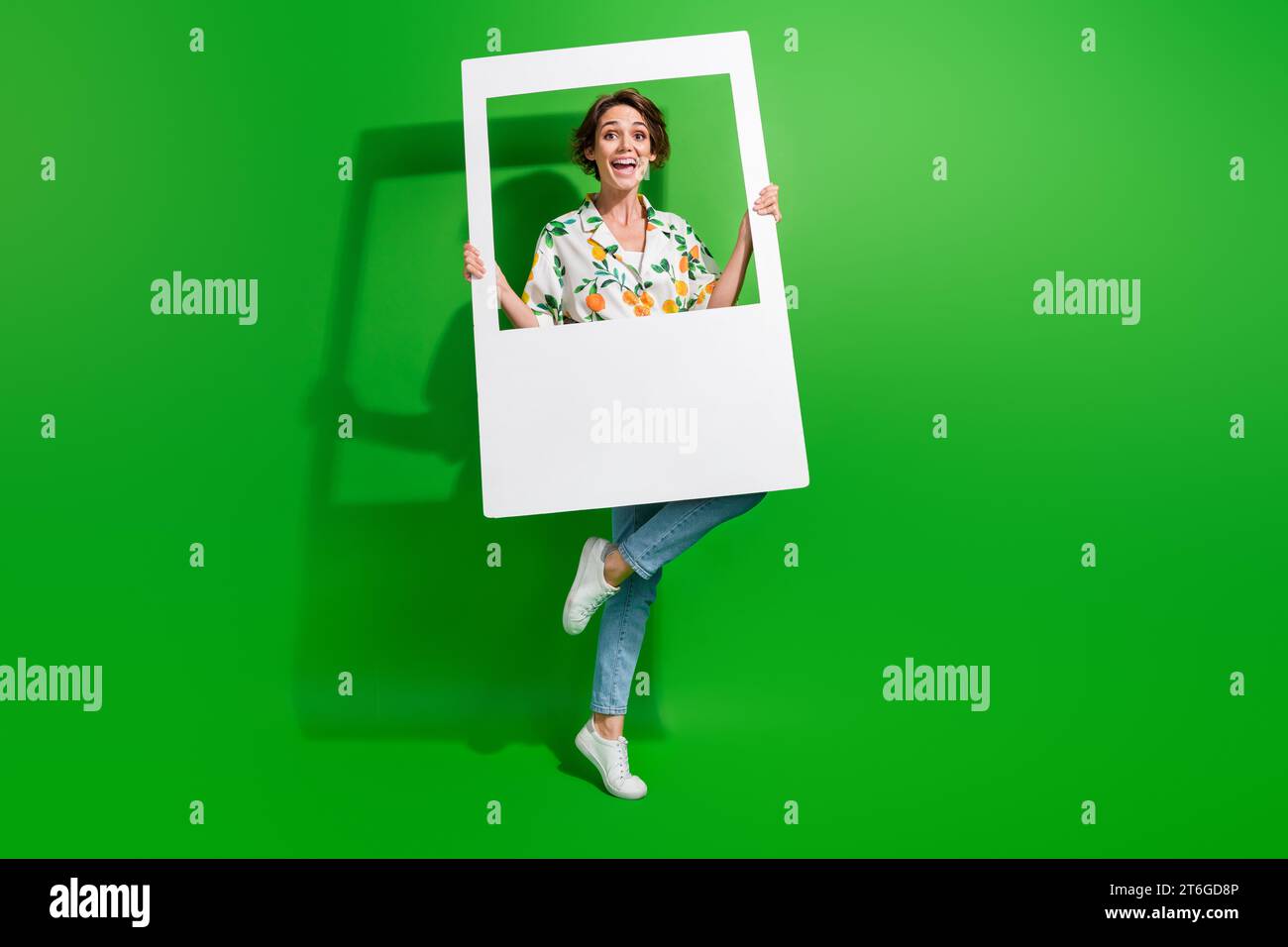 Full body length photo of attractive funky young lady hold paper frame ...