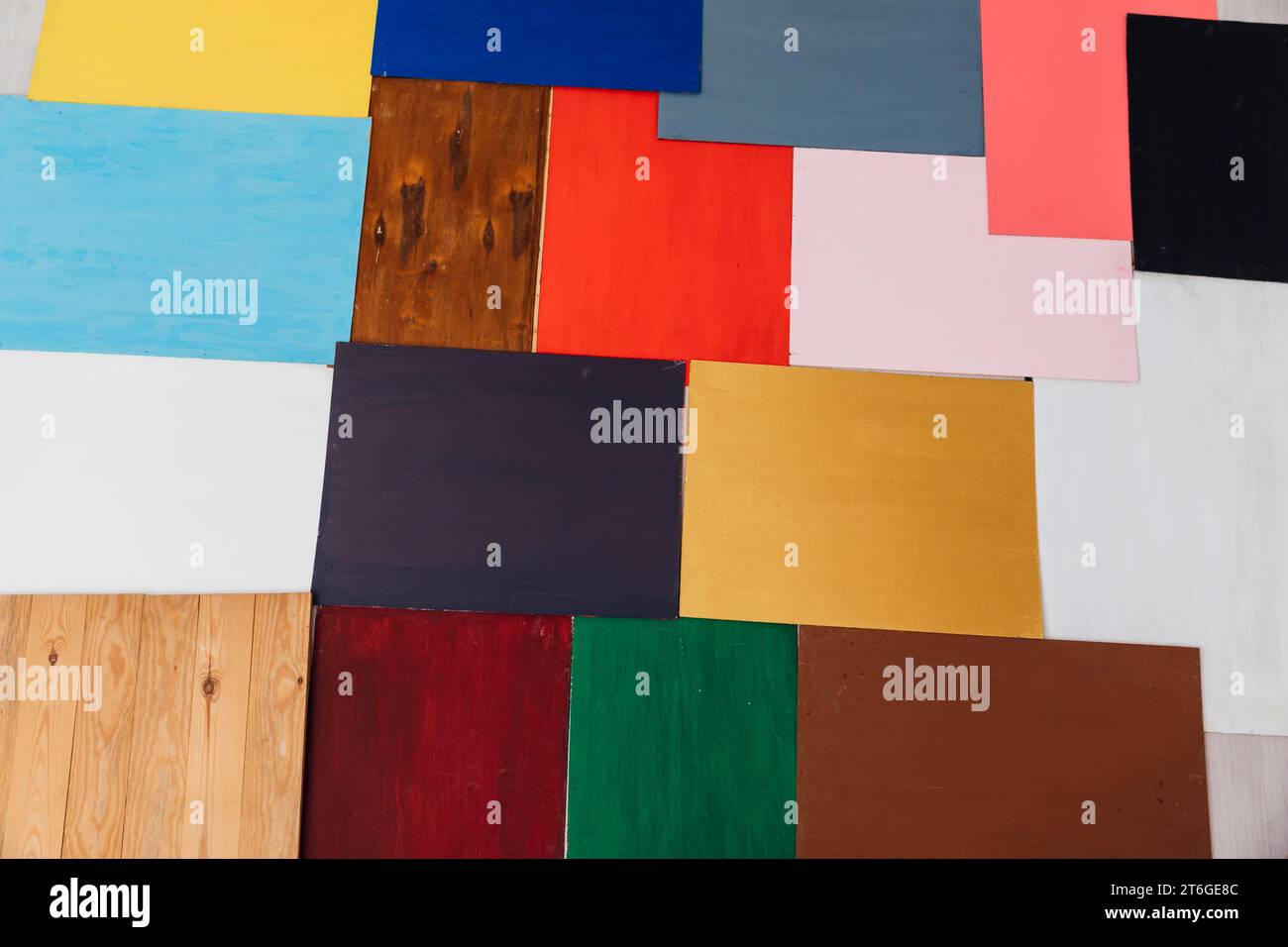 plywood of different colors as a background Stock Photo - Alamy