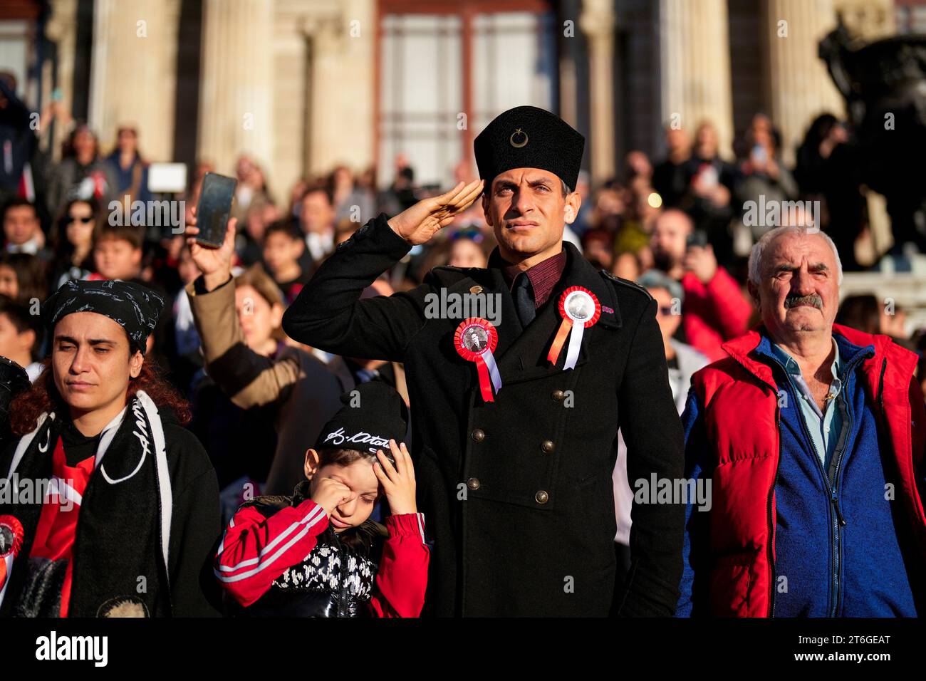 People observe a minute of silence to mark the 85th anniversary of ...