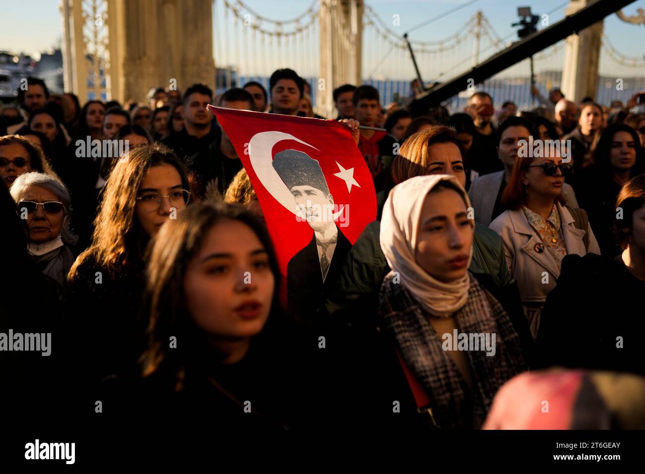 People sing the Turkish national anthem to mark the 85th anniversary of ...