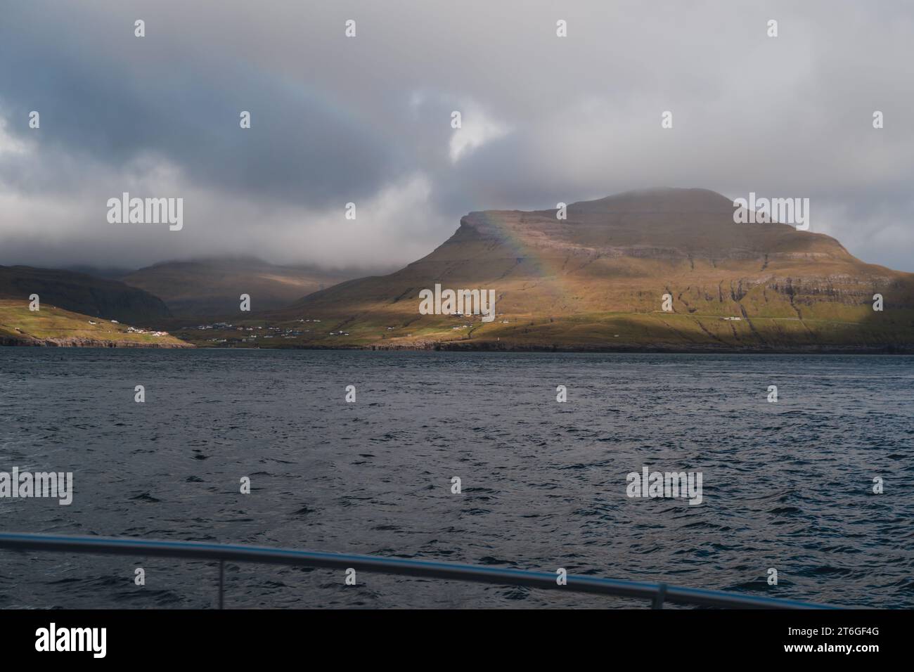 The rugged mountain peaks from a boat sailing along the coast Stock ...