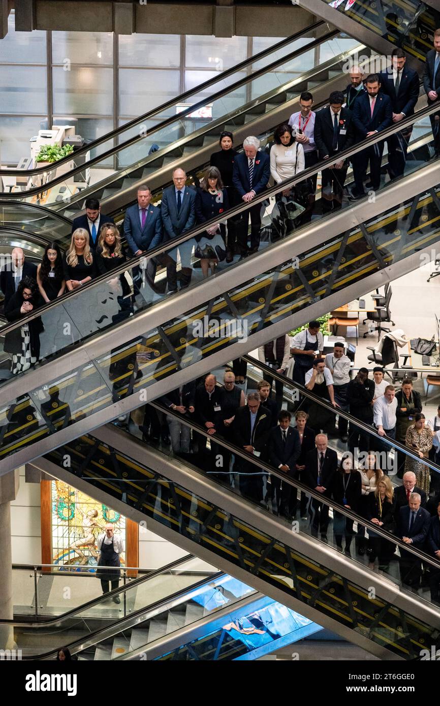 City workers join a Remembrance Day ceremony at Lloyd's of London, in ...