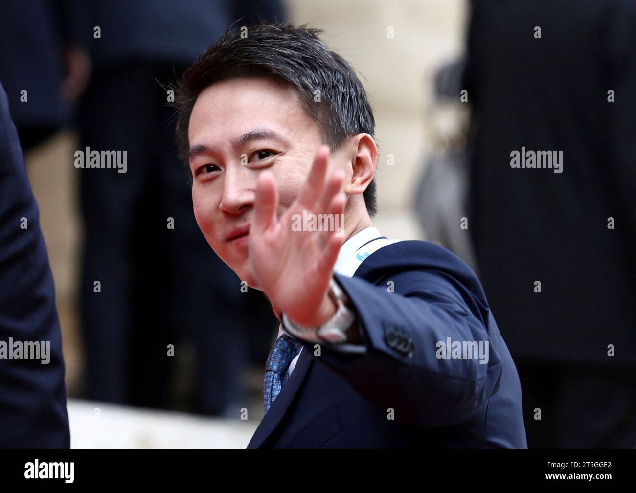 TikTok CEO Shou Zi Chew waves as he attends the Paris Peace Forum, in ...