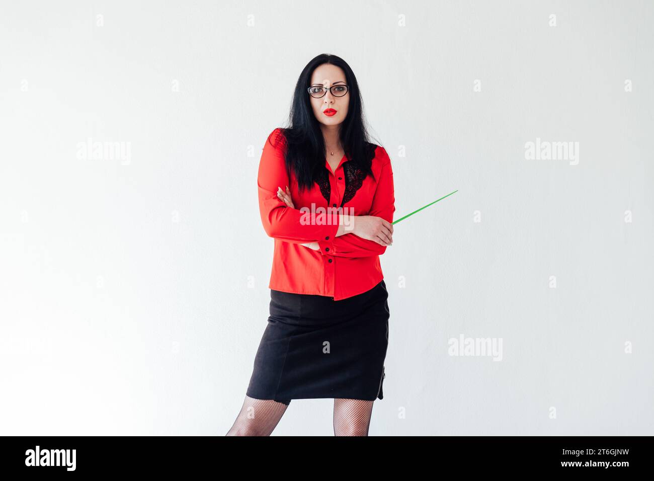 business woman teacher in red clothes Stock Photo - Alamy