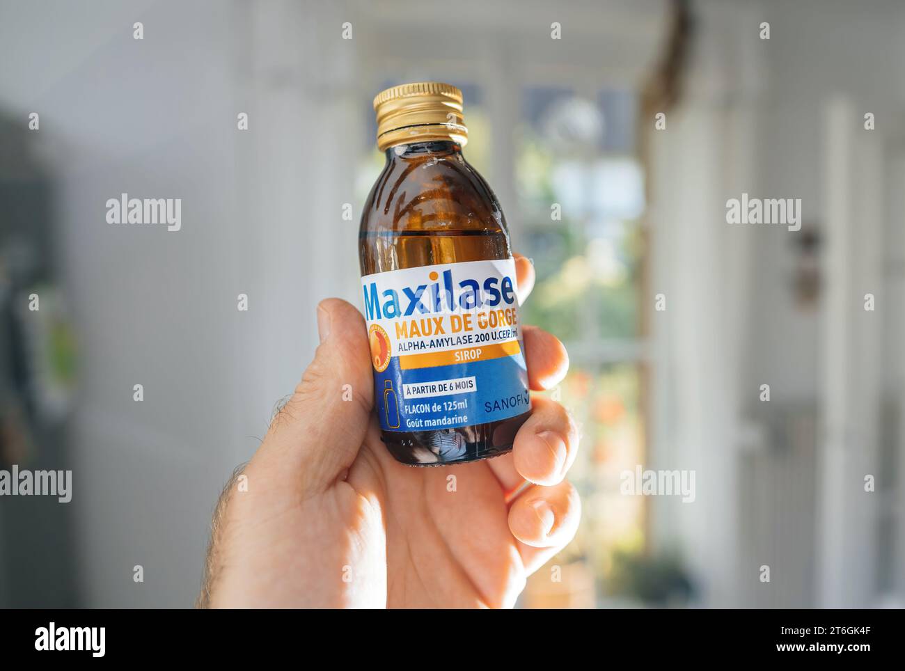 Frankfurt, Germany - Jun 12, 2023: Male hand holding Maxilase alpha ...