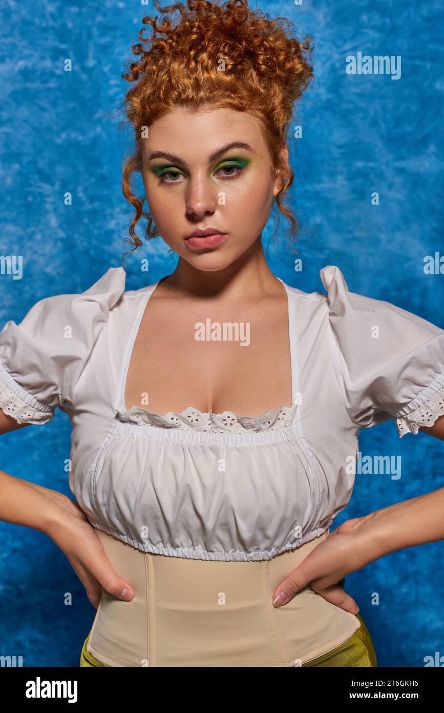 beautiful redhead plus size model in trendy attire with hands on hips ...
