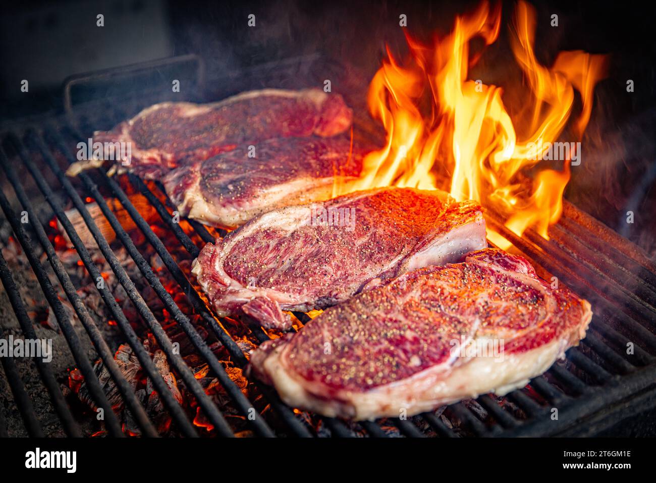 Grilling beef steak on bbq hi-res stock photography and images - Alamy