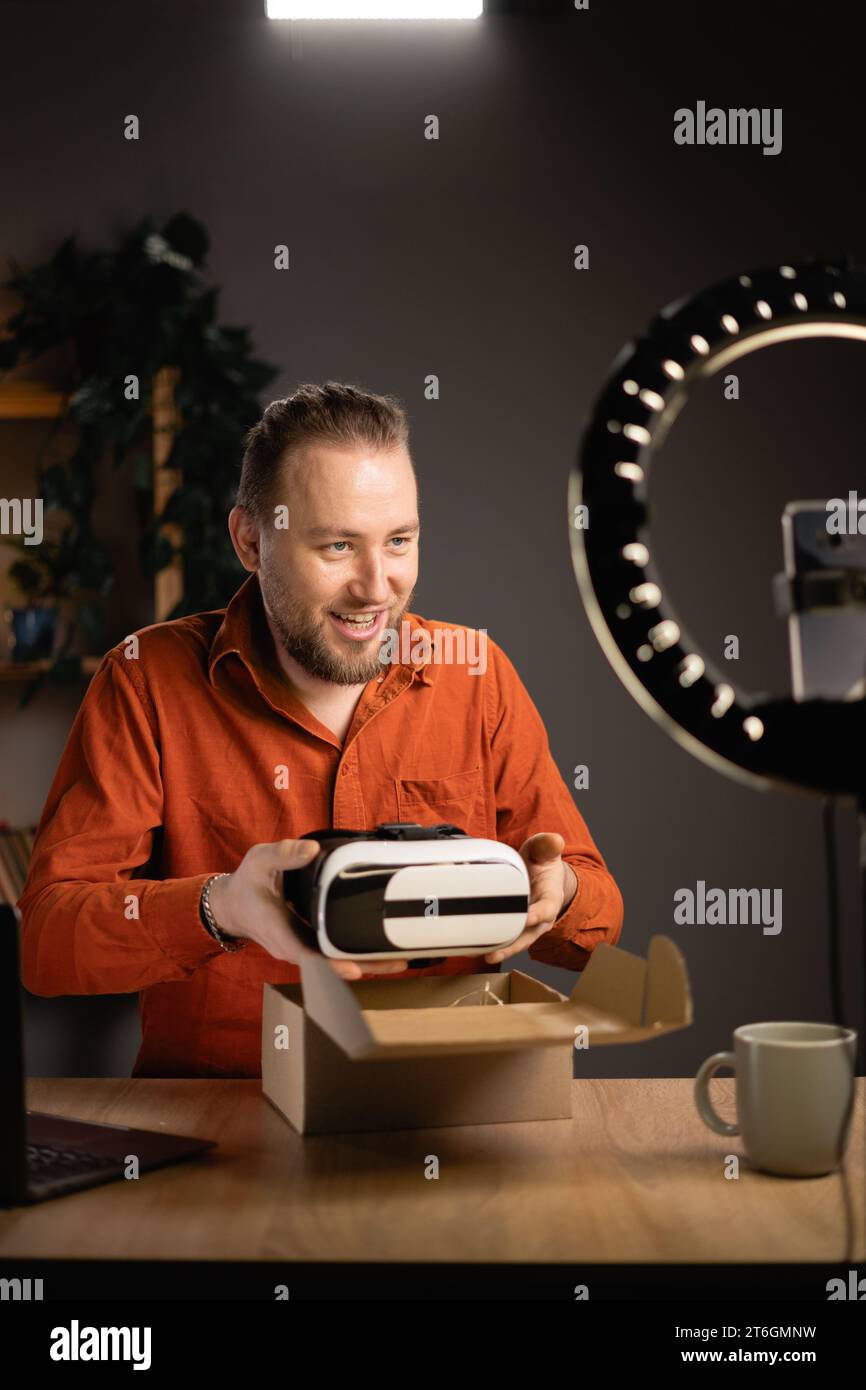 Unboxing video. Tech product review. Vlogger unboxing parcel with VR ...