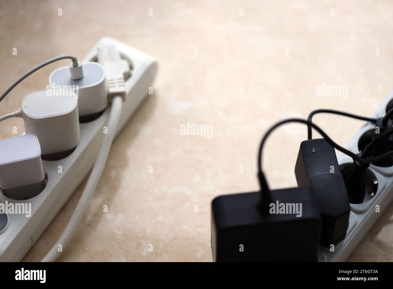 Overloaded power boards. Power strips with different electrical plugs ...