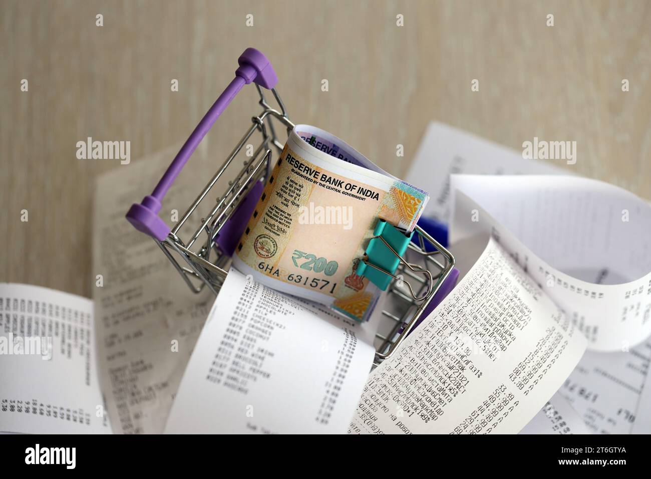 Indian rupees money bills bunch in shopping trolley surrounded by many ...